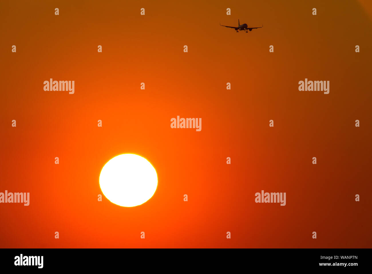 Aircraft carrier at sunset hi-res stock photography and images - Alamy