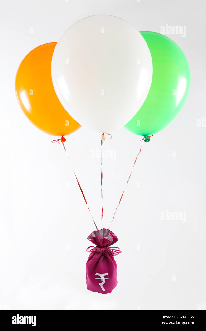Money bag flying with colorful helium balloons Stock Photo - Alamy