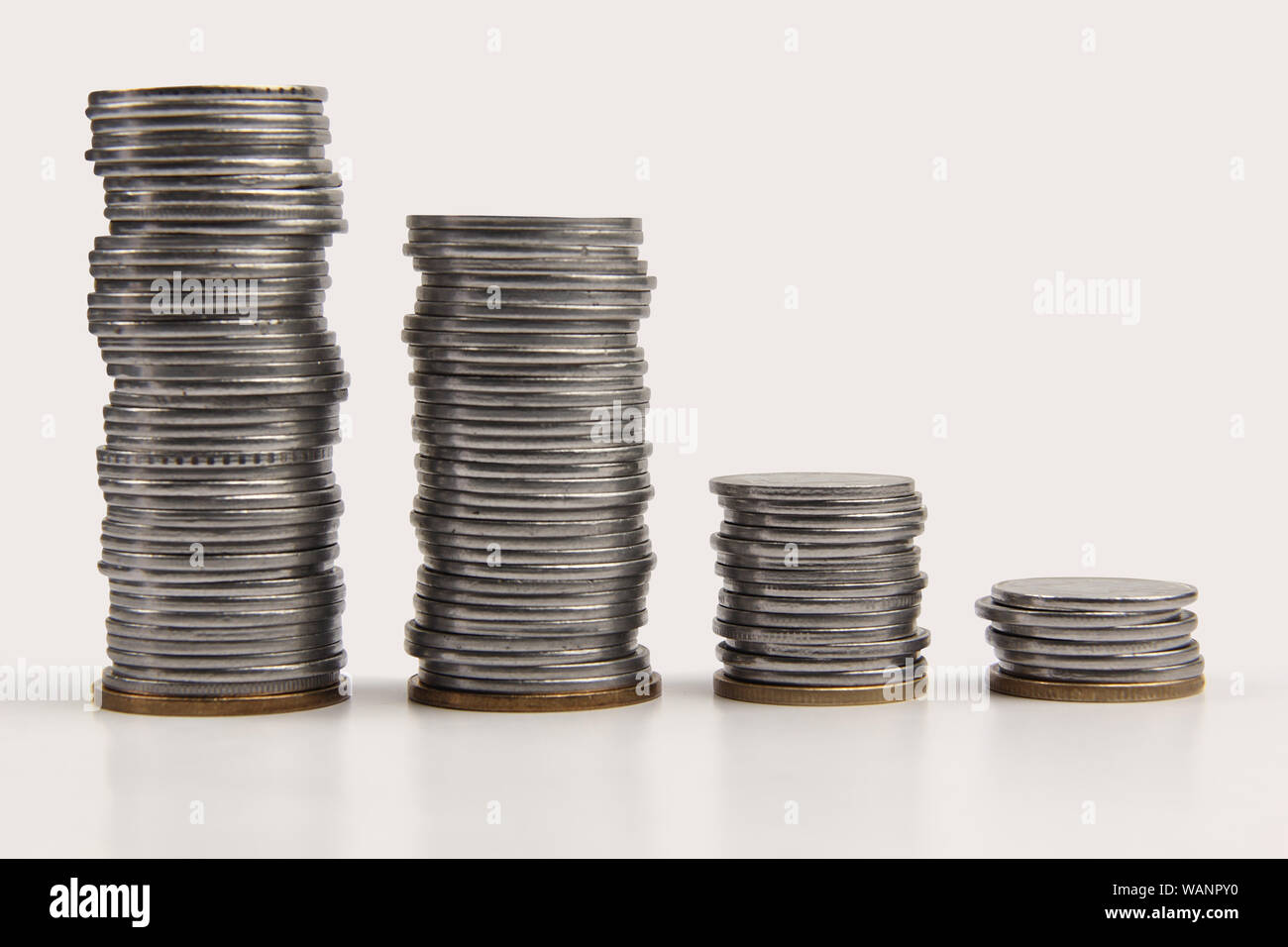 Four rows of stack of golden coins Stock Photo - Alamy