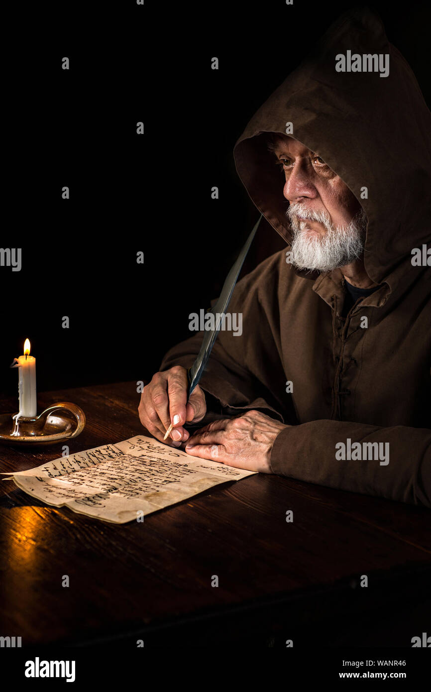 medieval writer monk in thought Stock Photo - Alamy