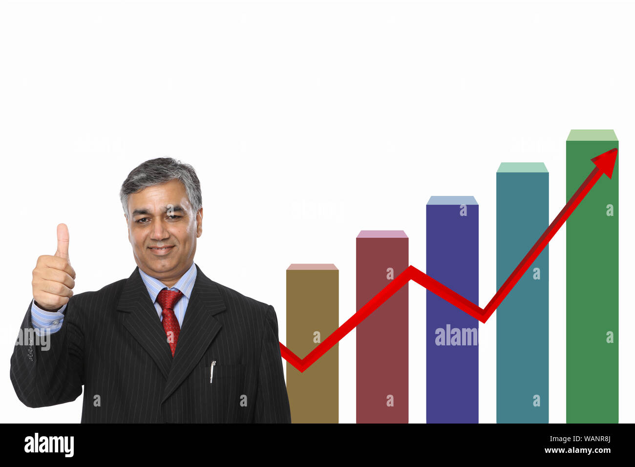 Businessman showing thumbs up sign in front of bar graph rising upward ...