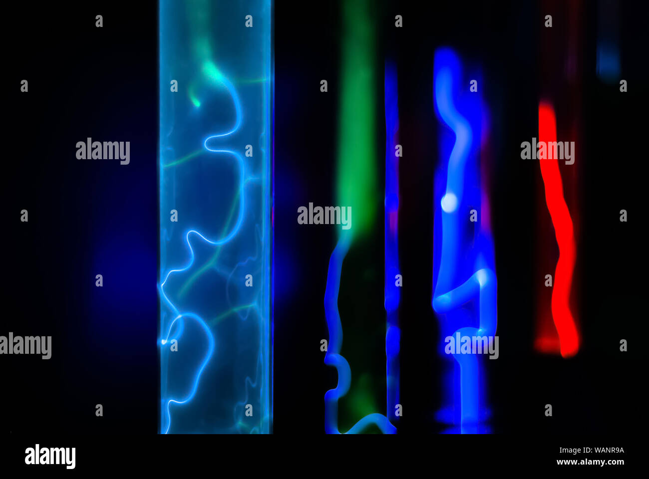 abstract neon background - lightning and glowing electrical discharges ...