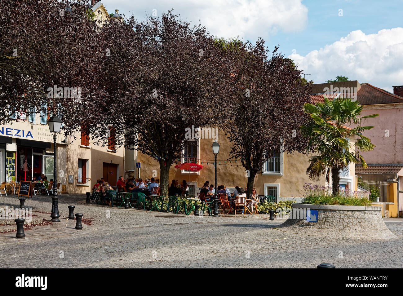 people eating, outdoors, under trees, restaurant, street side ...