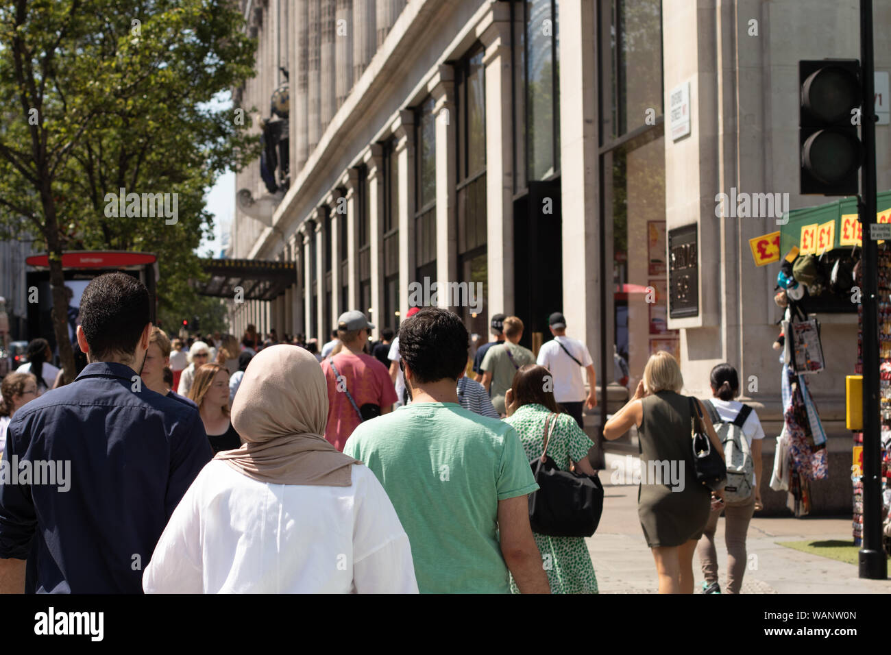 people are walking down London high street at midday Stock Photo - Alamy