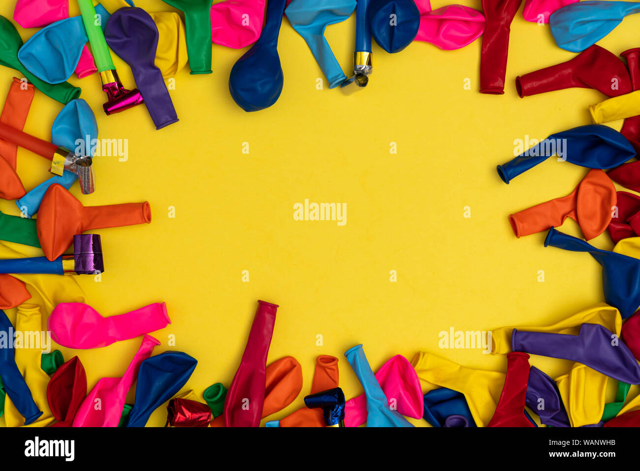 Deflated balloons and party accessories, with copyspace. Assorted ...