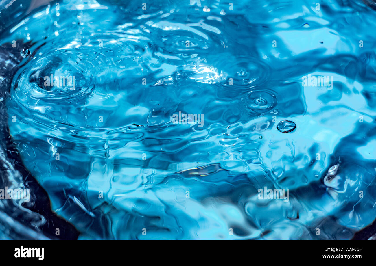 Drop of water. Blue water drop. Falling water. Water splash close-up ...