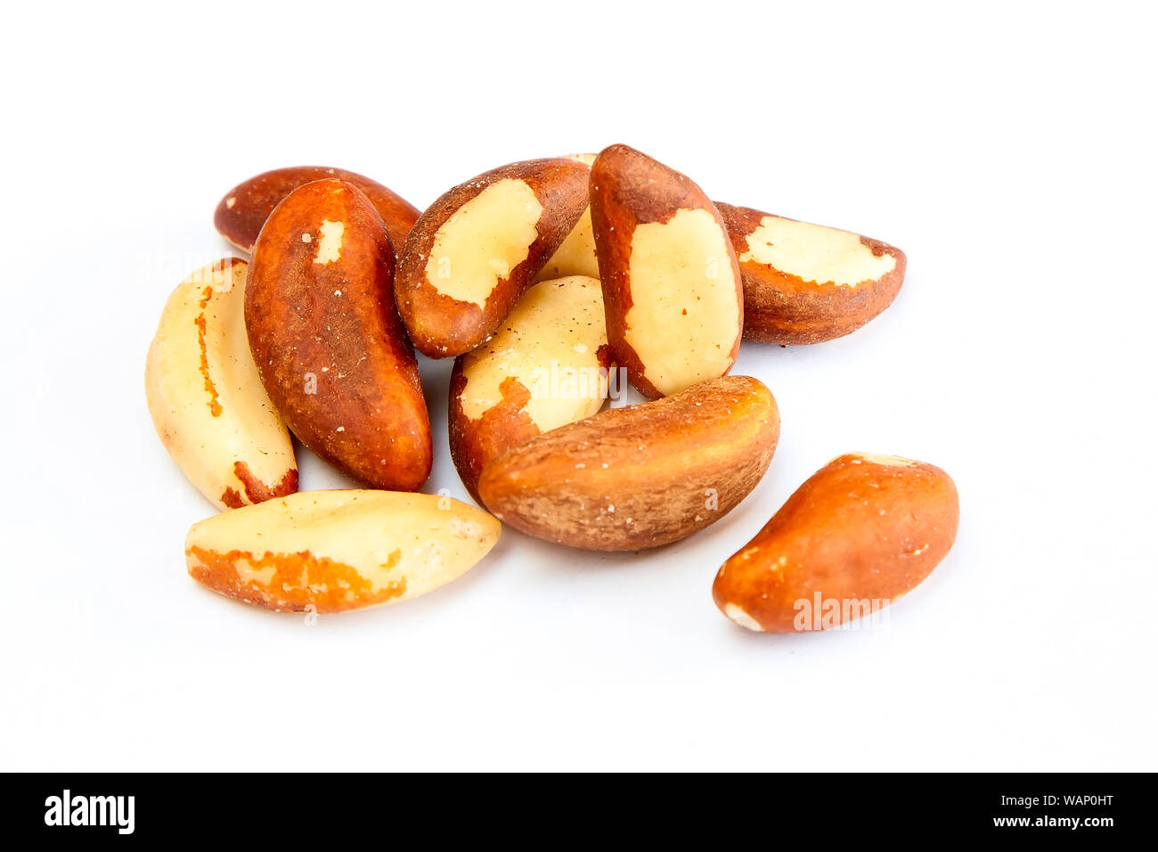 Few Brazil nuts isolated on white background Stock Photo - Alamy