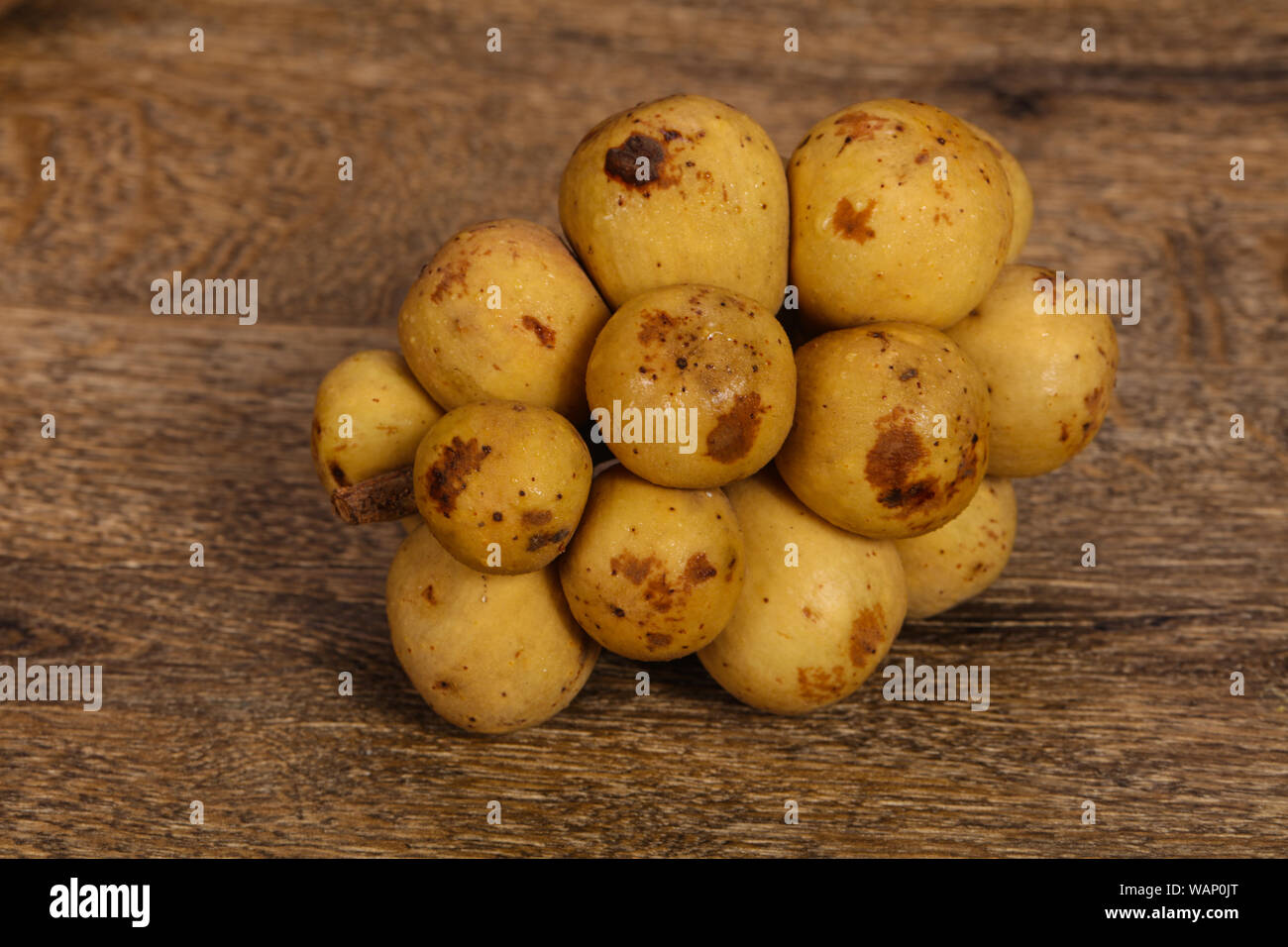 Sweet tasty tropical fruit Langsat heap Stock Photo - Alamy