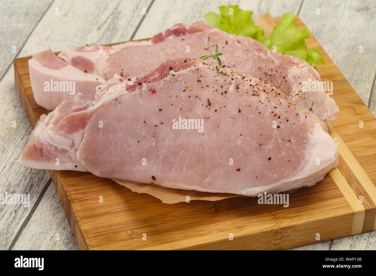 Raw pork meat steak ready for grill Stock Photo - Alamy