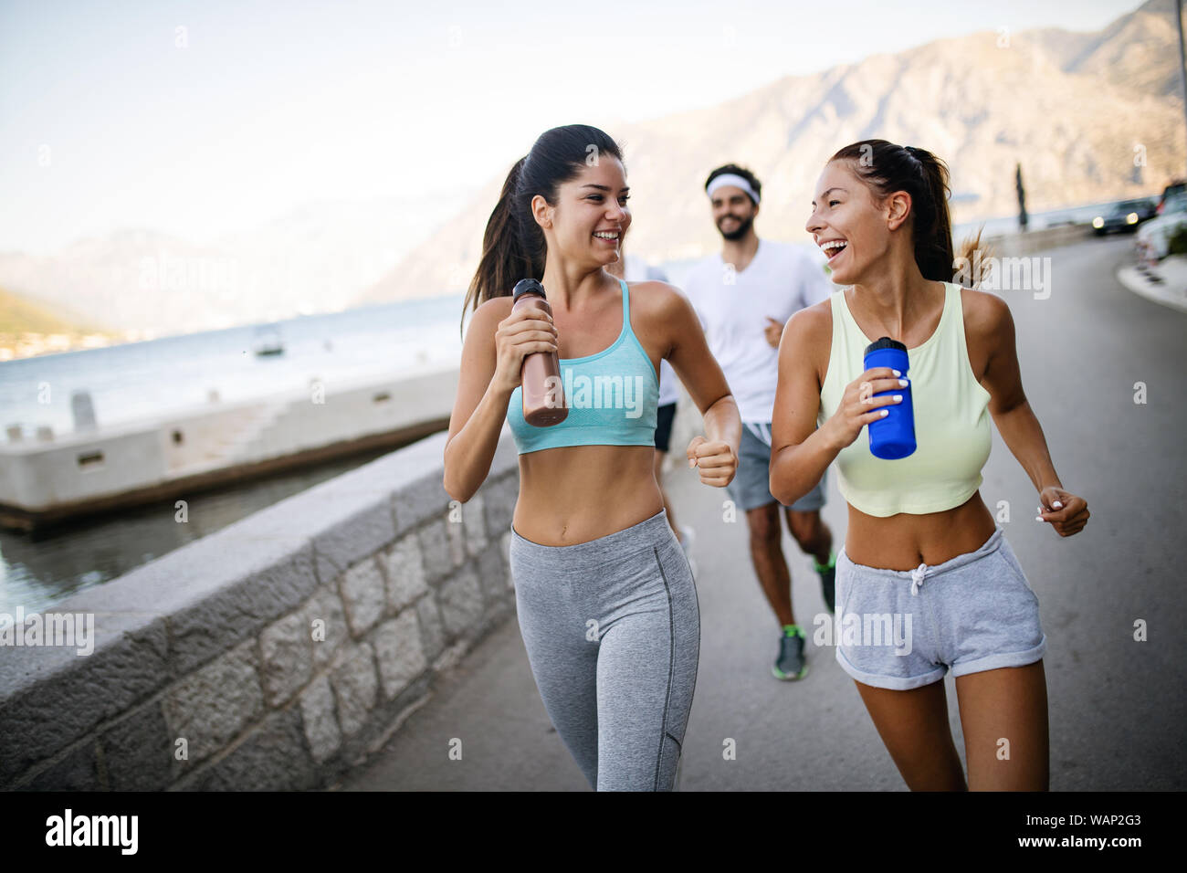 Group of friends jogging in nature hi-res stock photography and images ...
