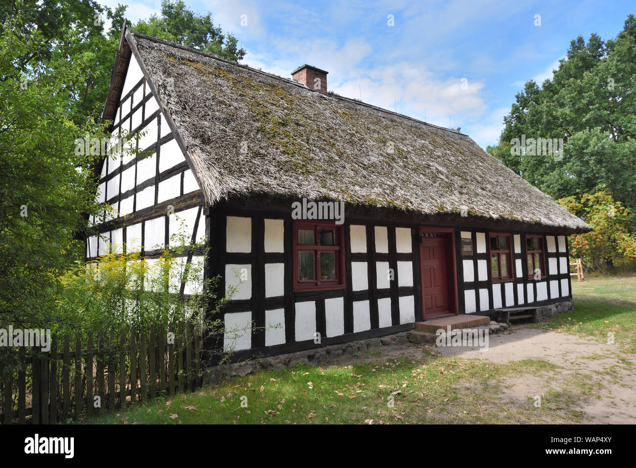 Old whitewashed house with thatched roof in The Folk Culture Museum in ...