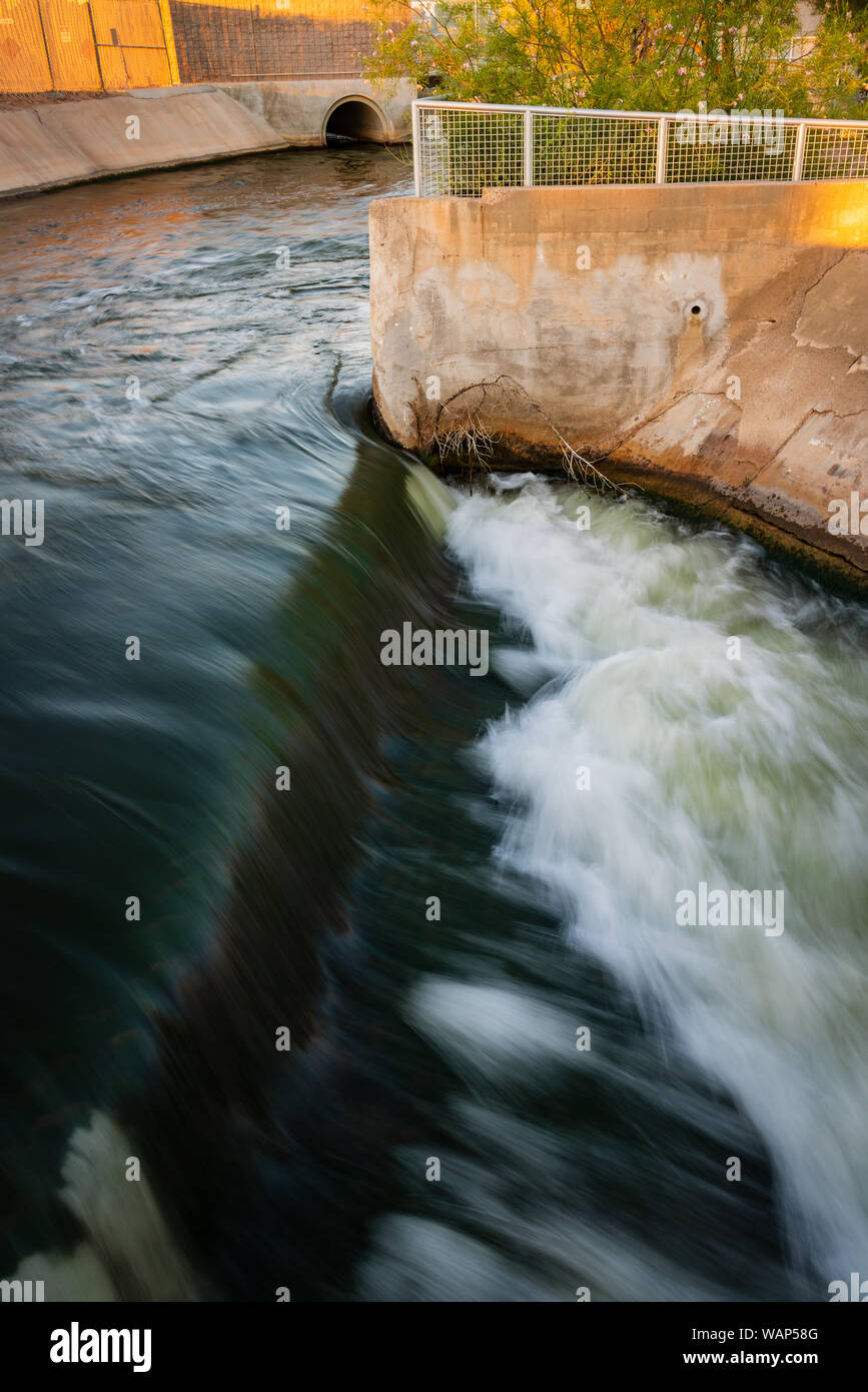 Closeup view of water about to fall down a 20-foot drop through the ...