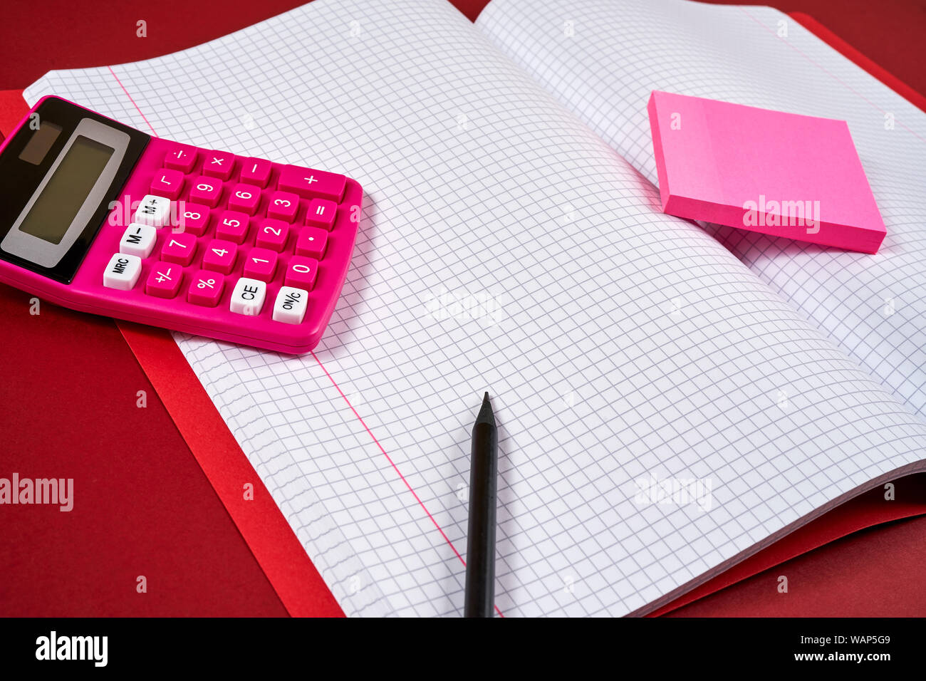 open notebook with checkered pages and calculator and pencil Stock ...