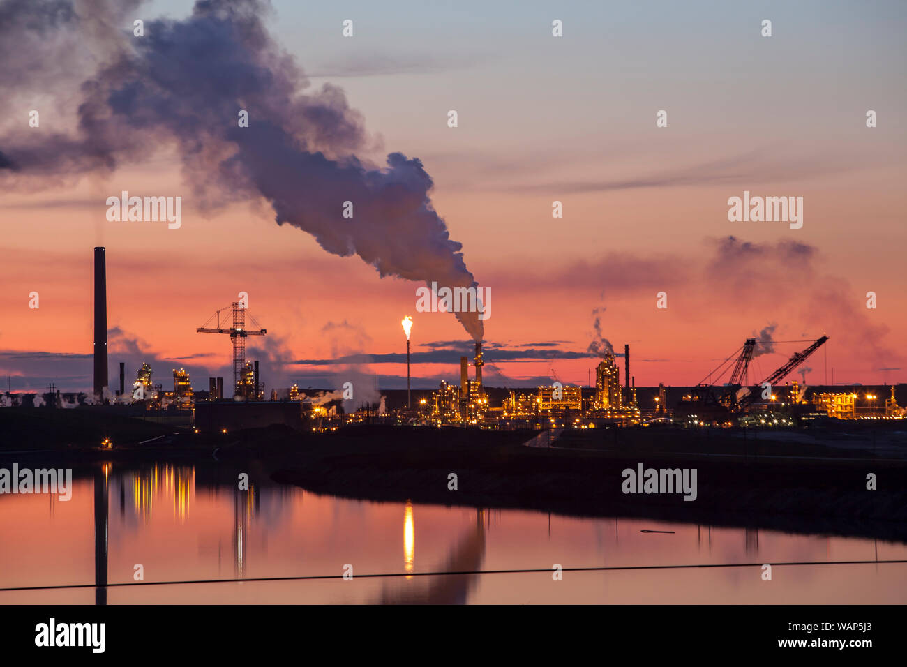 Evening photo of Syncrude oil sands operations north of Fort McMurray ...