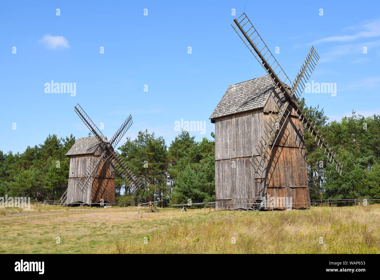 Old wooden windmills in The Folk Culture Museum in Osiek by the river ...