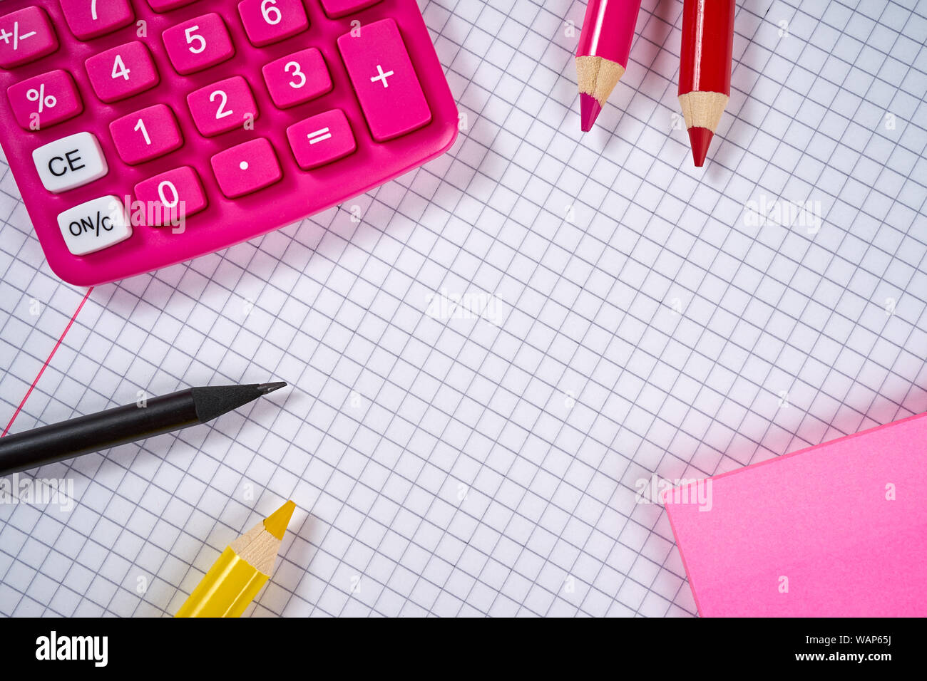 open notebook with checkered pages and calculator and pencil Stock ...