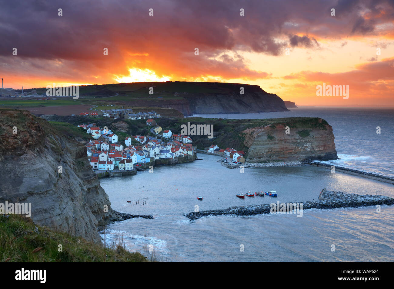 Sun setting over Staithes, North Yorkshire, England, Great Britain ...