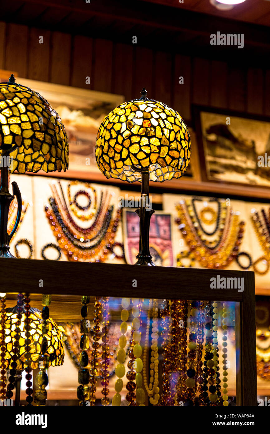 Amber lamps and beaded necklaces at a stall inside the Cloth Hall ...