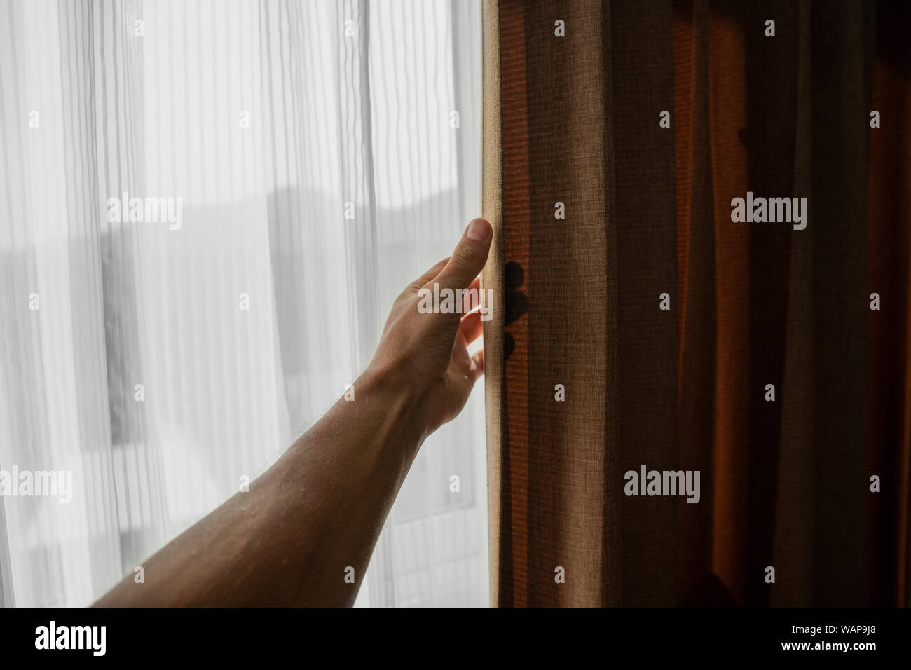 Hand opening curtain hi-res stock photography and images - Alamy