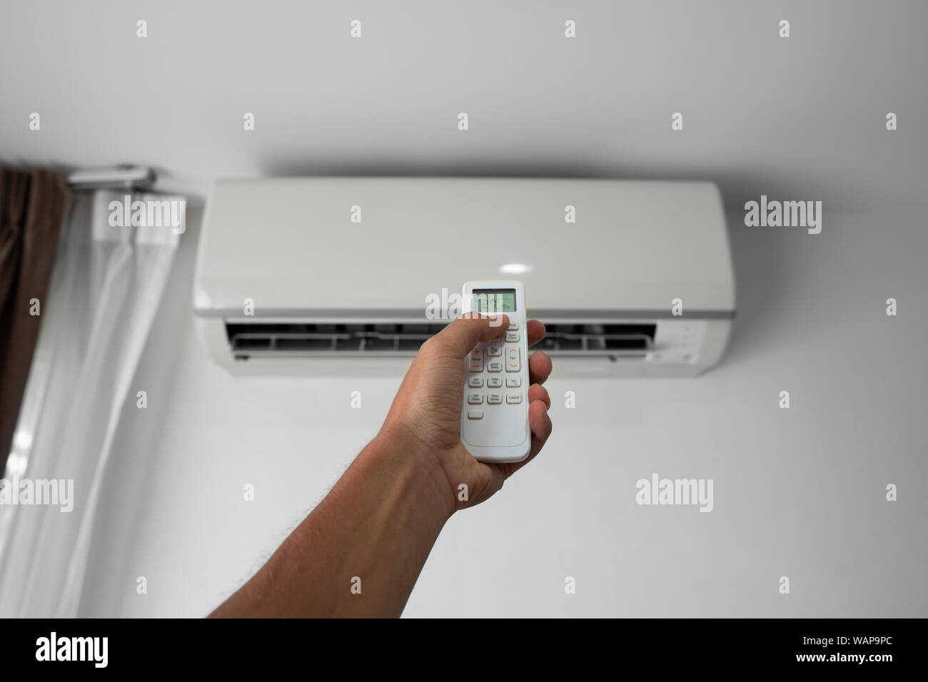 Man's hand using remote controler. Hand holding rc and adjusting ...