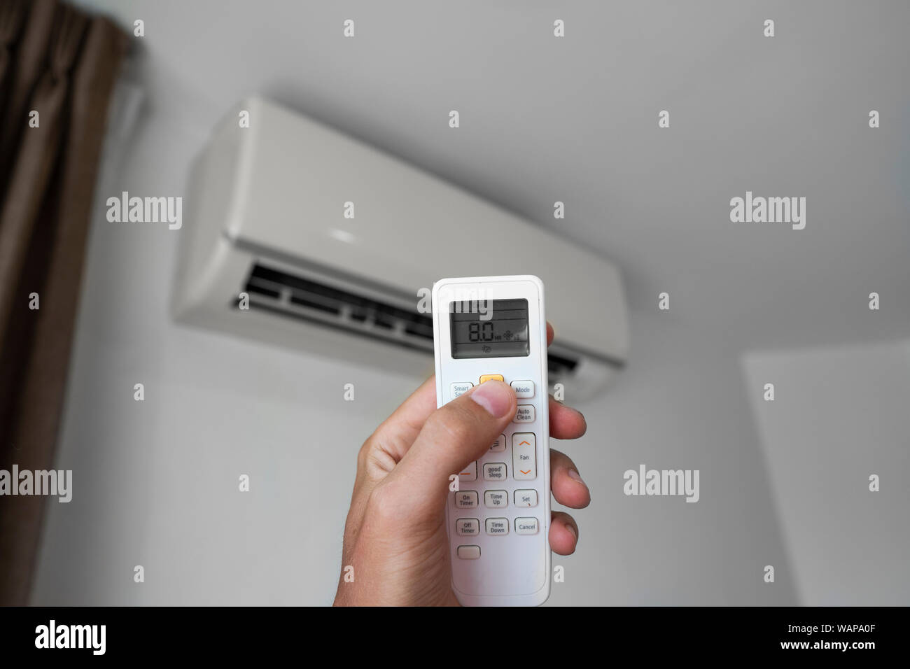 Man's hand using remote controler. Hand holding rc and adjusting ...