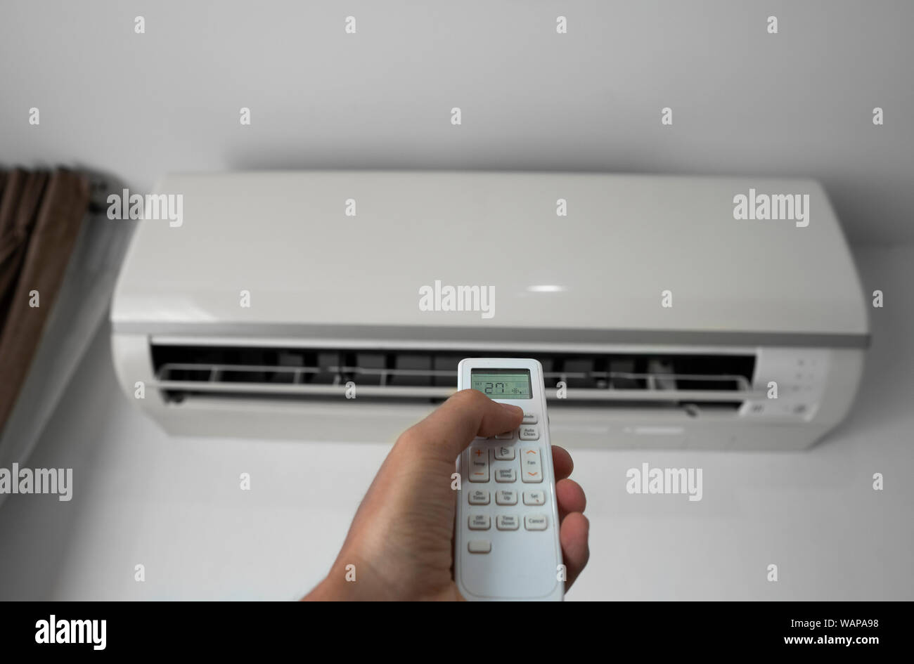 Man's hand using remote controler. Hand holding rc and adjusting ...