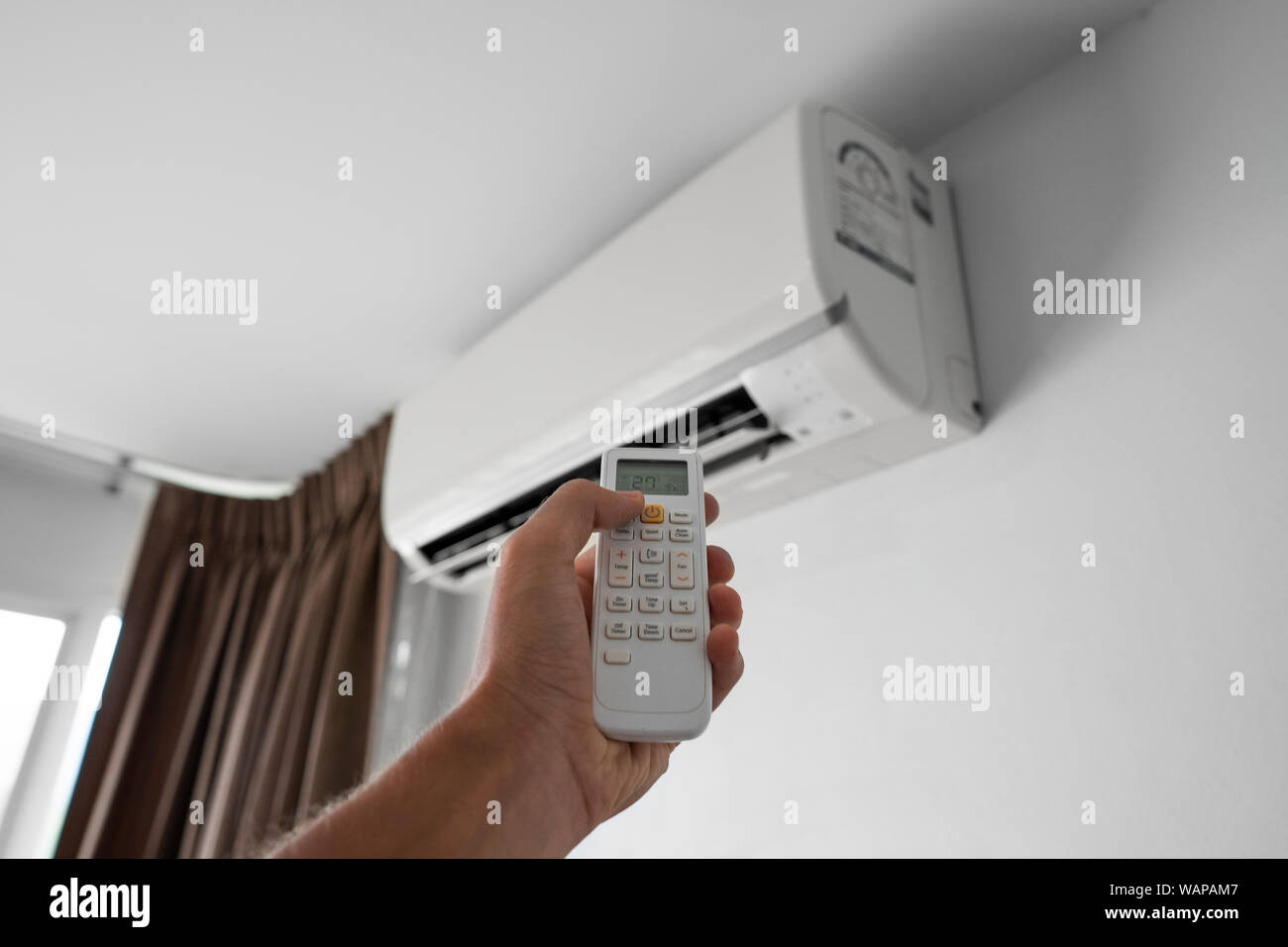 Man's hand using remote controler. Hand holding rc and adjusting ...