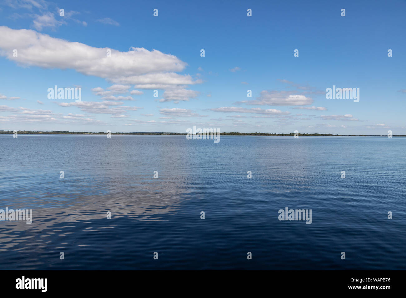 Clouds and reflections in Lough Corrib lake, Cong, Mayo, Irelnd Stock ...