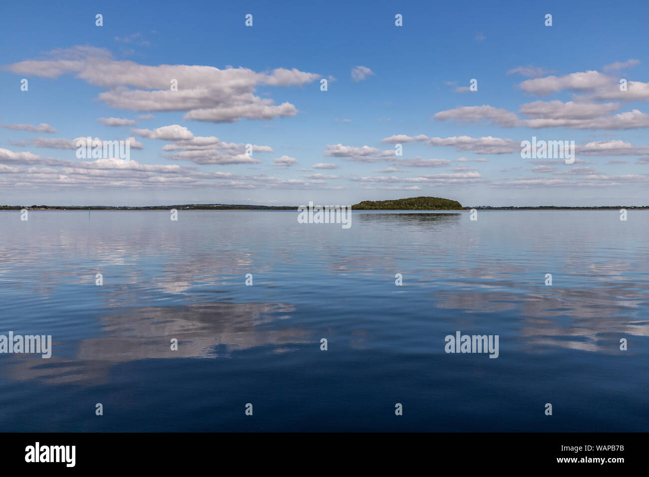 Island, Clouds and reflections in Lough Corrib lake, Cong, Mayo ...