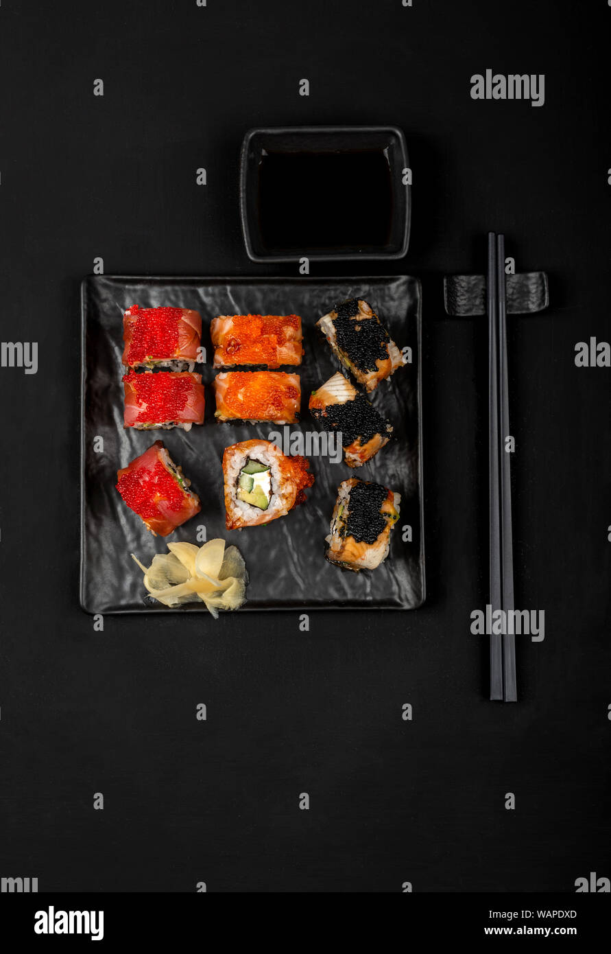 Set of sushi rolls on stone table. Top view with copy space Stock Photo ...