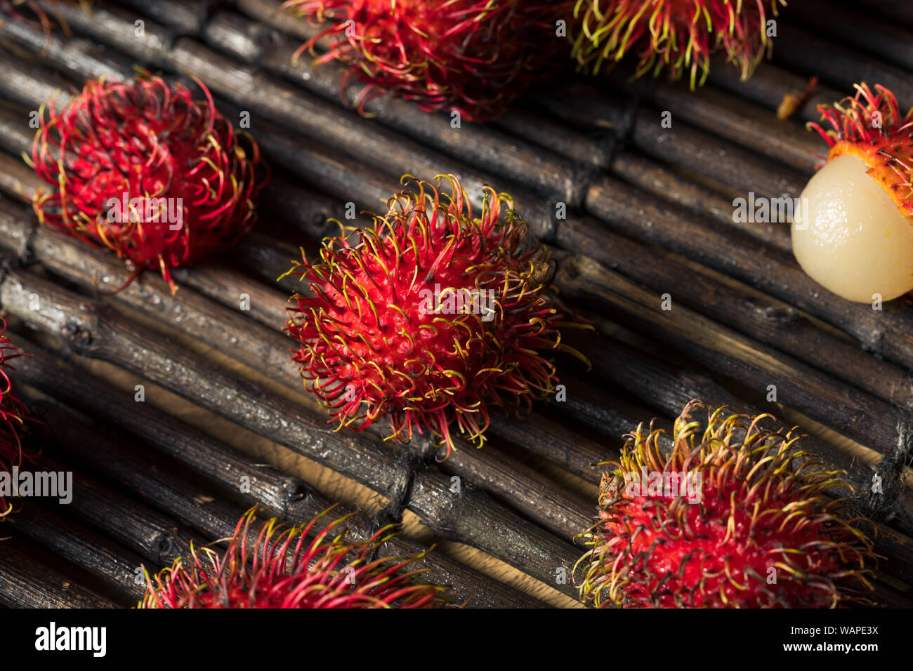 Raw Red Organic Rambutan Fruit Ready to Eat Stock Photo - Alamy