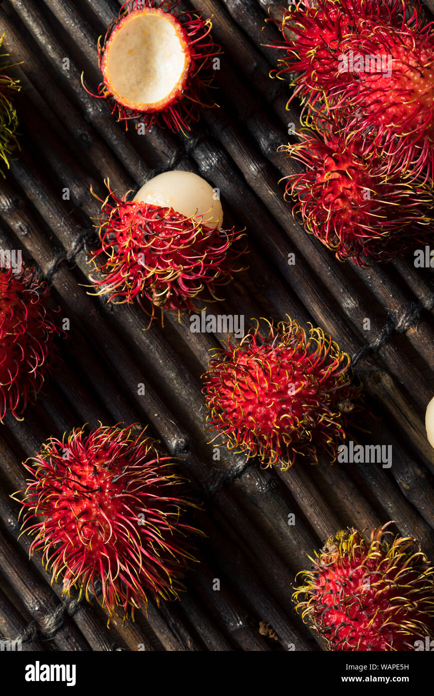 Raw Red Organic Rambutan Fruit Ready to Eat Stock Photo - Alamy