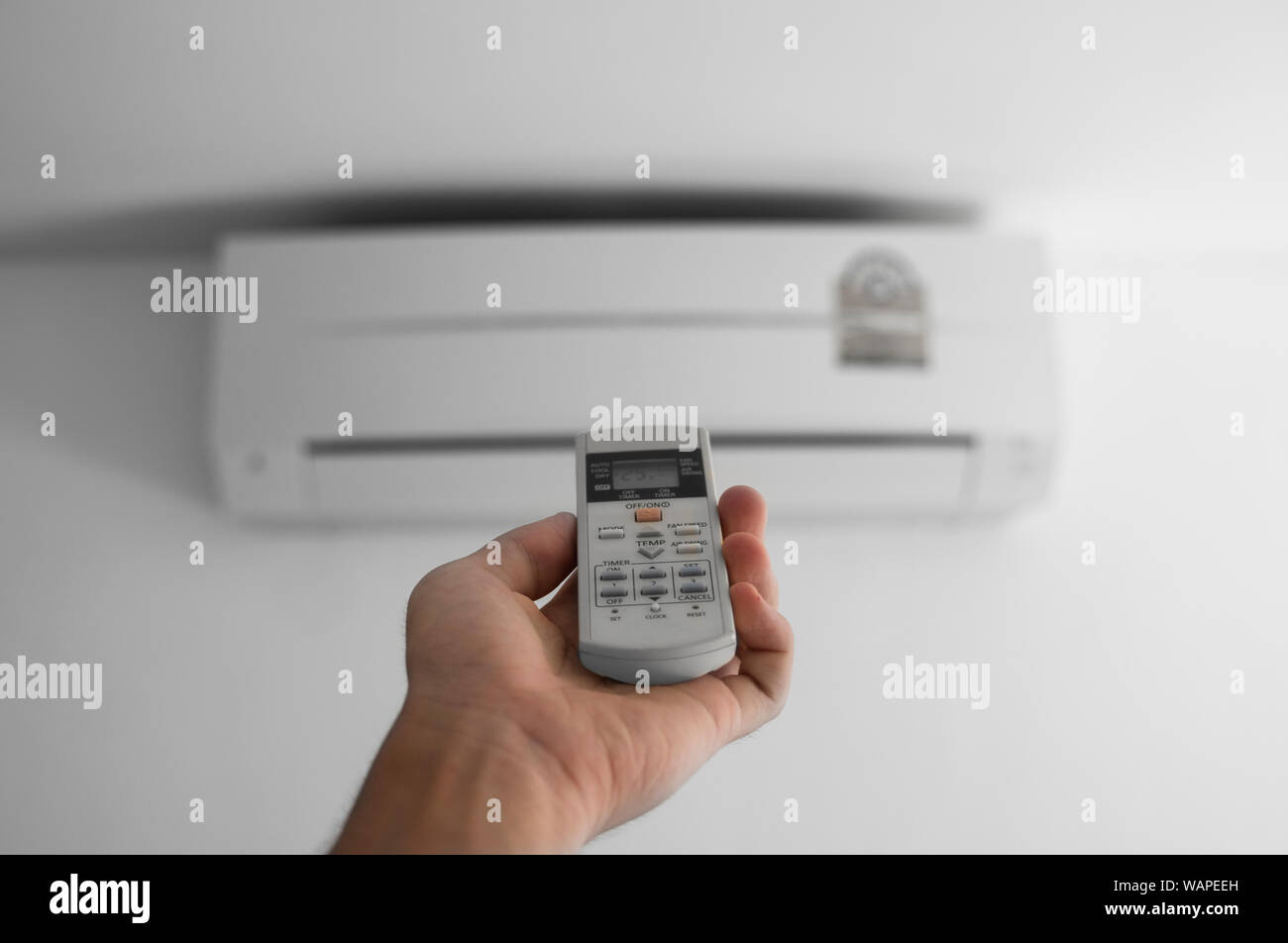 Man's hand using remote controler. Hand holding rc and adjusting ...