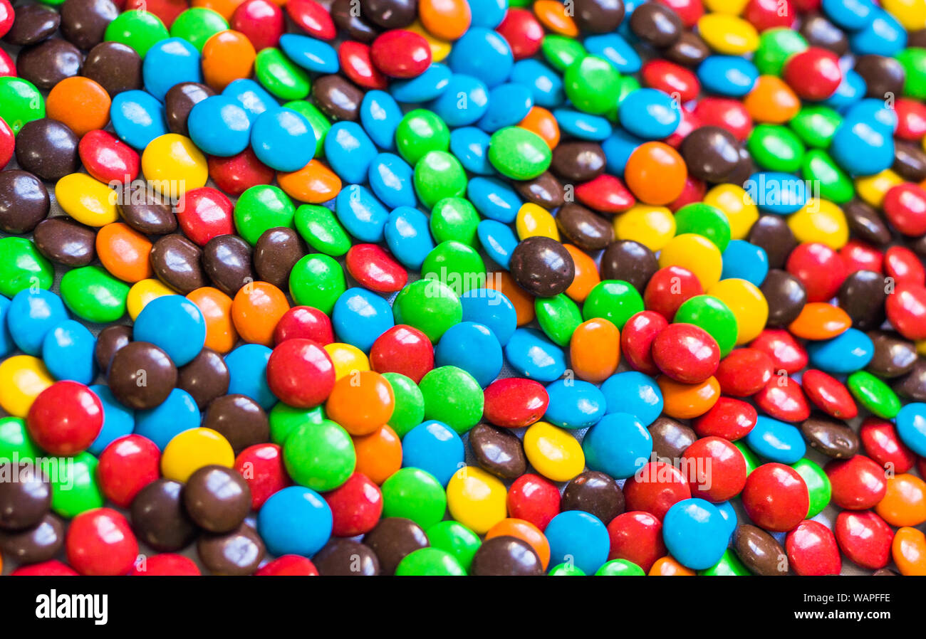 Assortment of sweet dessert colorful chocolate candy. Food background ...