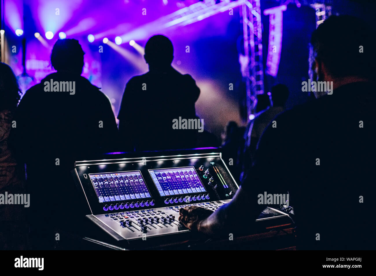 Professional sound engineer console at concert. Remote control for ...