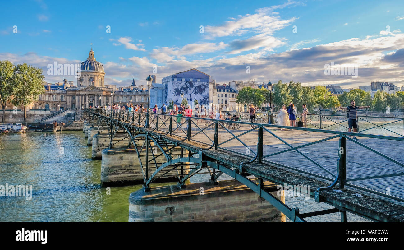 Pont des Arts, Paris, France - July 30, 2018: Institut de France and ...