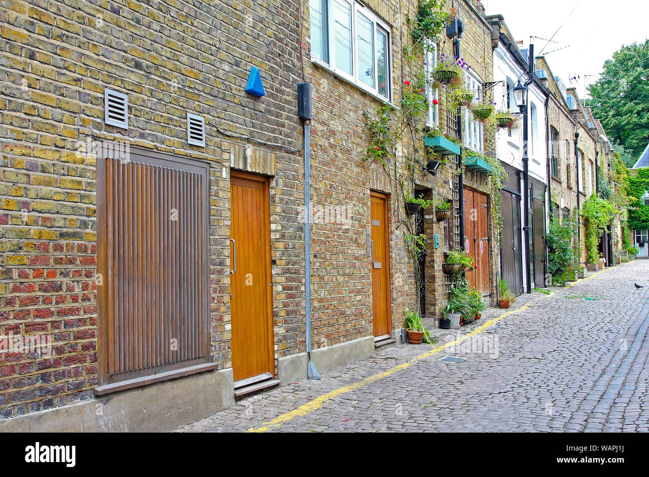 Old houses in small cobbled street in London Stock Photo - Alamy