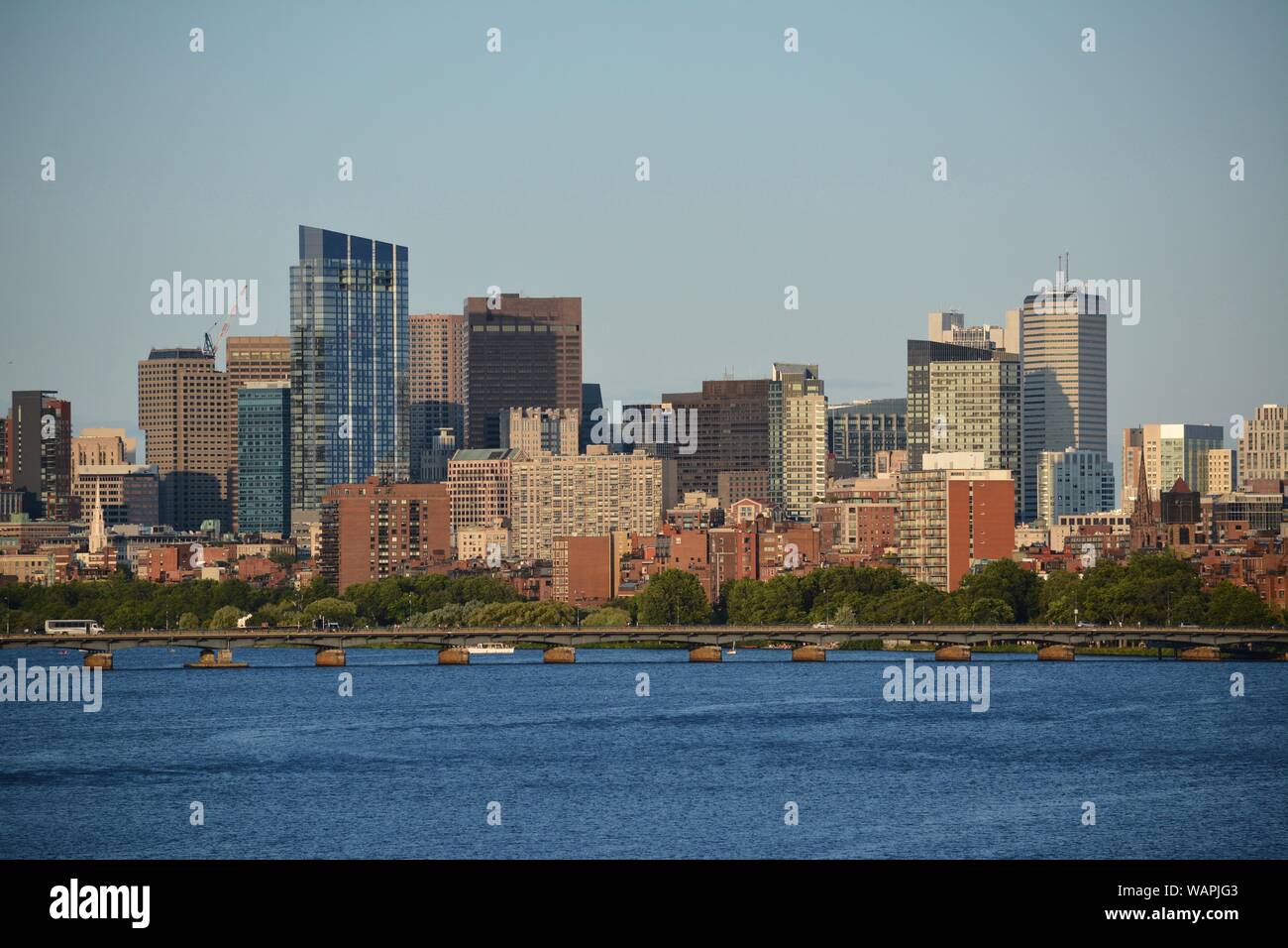 The Boston skyline as seen from across the Charles River at sunset ...