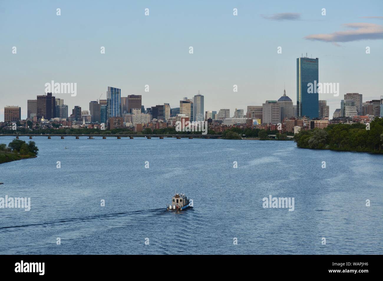 The Boston skyline as seen from across the Charles River at sunset ...