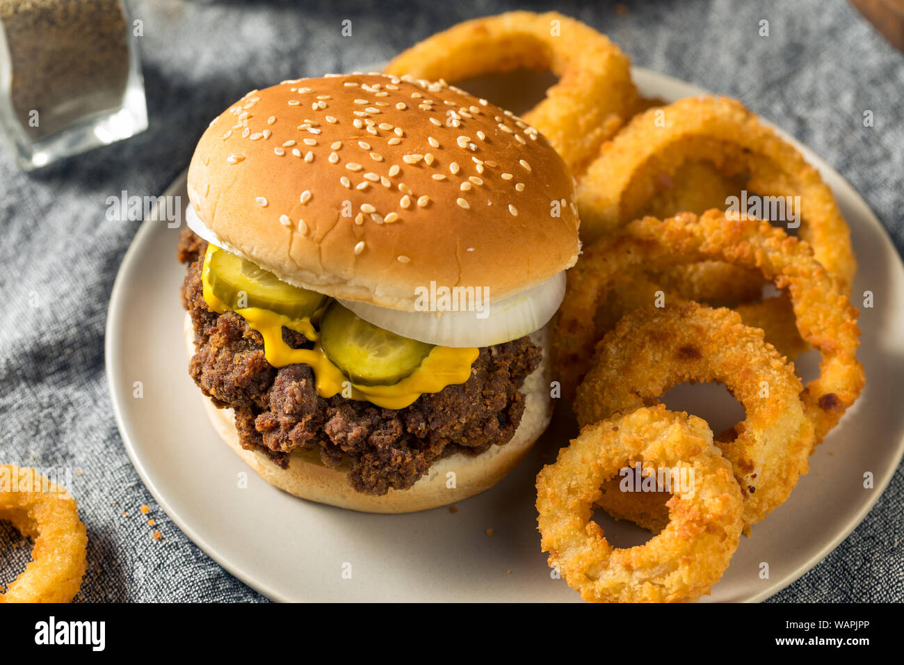 Homemade Mississippi Slug Burgers with PIckle and Onion Rings Stock ...