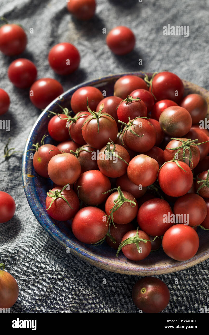 Raw Red Heirloom Cherry Tomatoes in a Bowl Stock Photo - Alamy