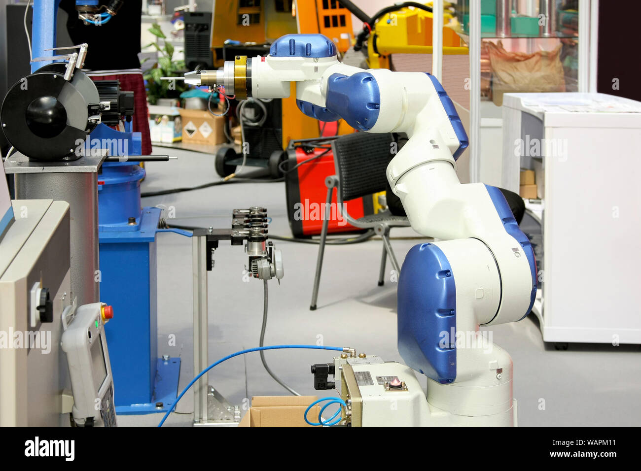 White robotic arm for industry production isolated Stock Photo - Alamy