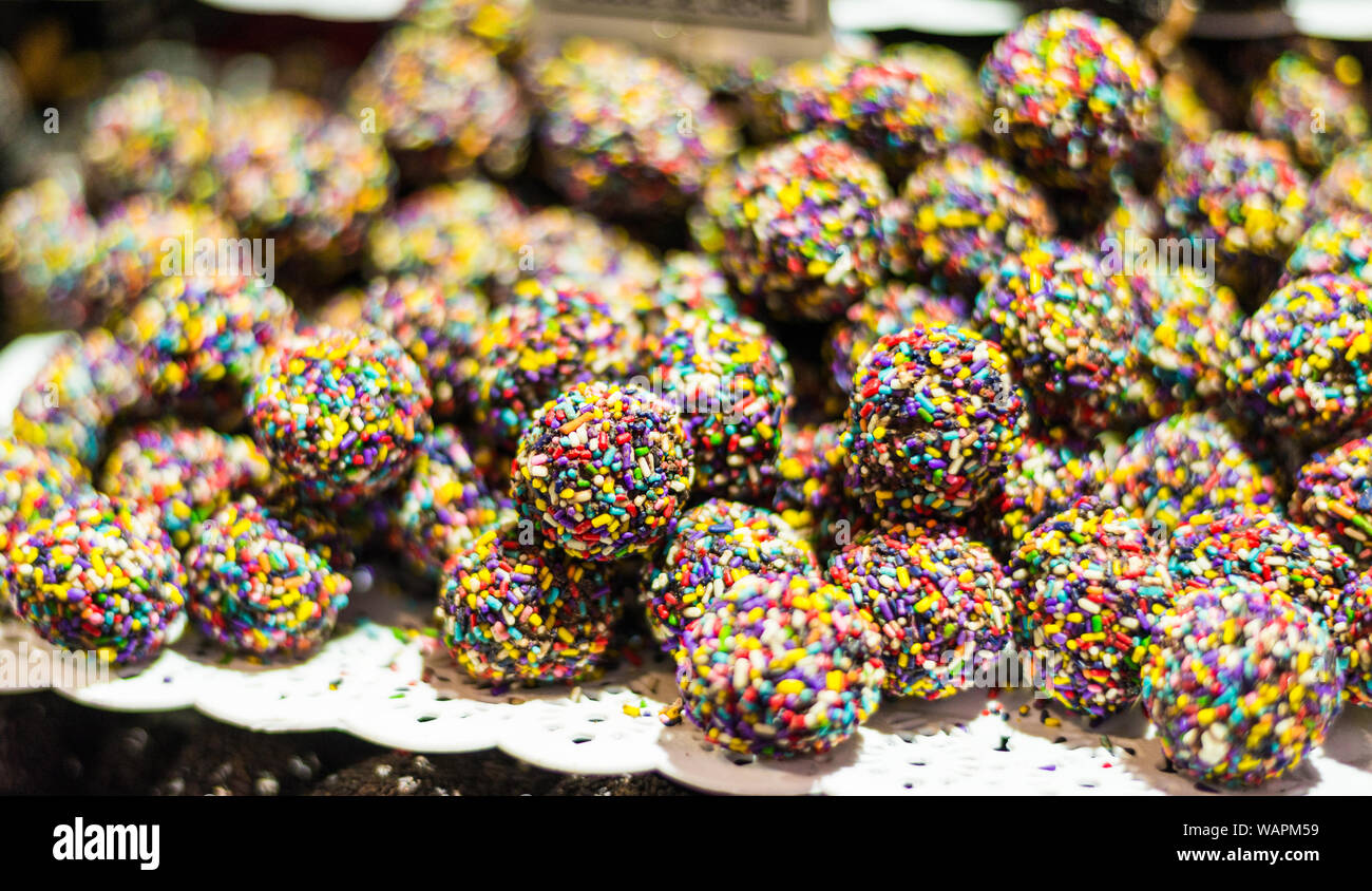 Colorful chocolate truffle candies at a street food market Stock Photo ...
