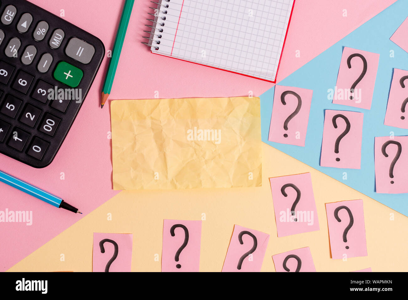 Mathematics stuff and writing equipment above pastel colours background ...