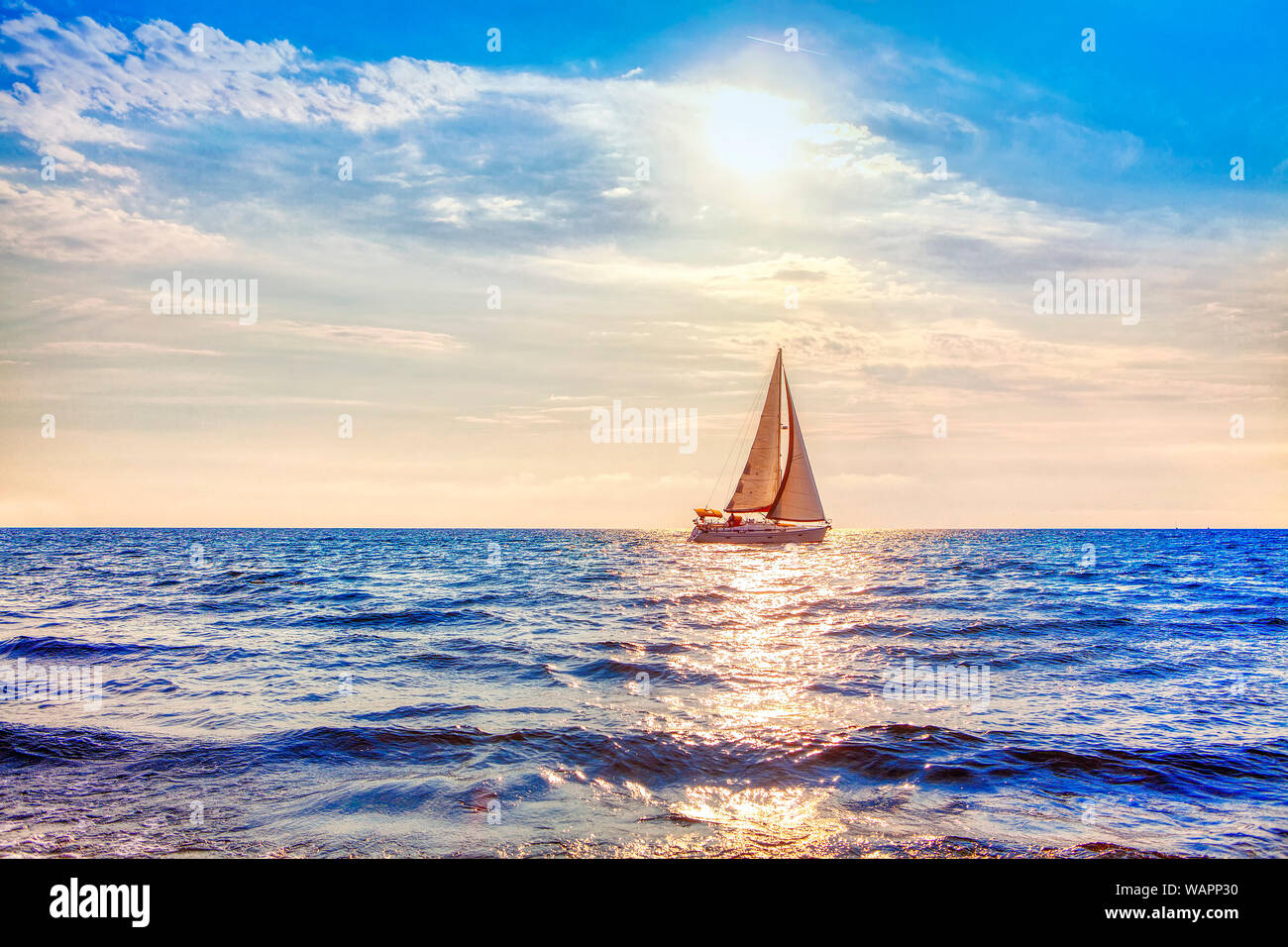 modern yacht sailing and sun shining Stock Photo - Alamy