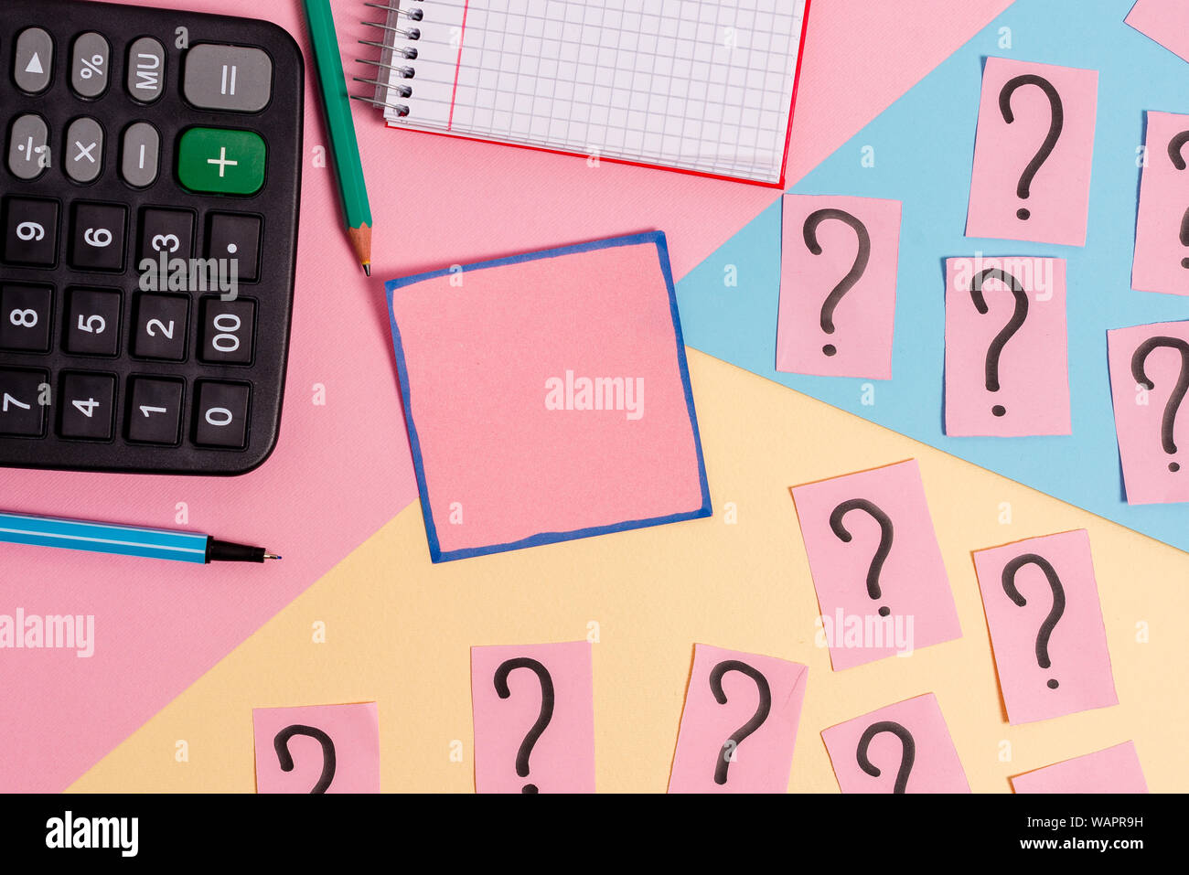 Mathematics stuff and writing equipment above pastel colours background ...