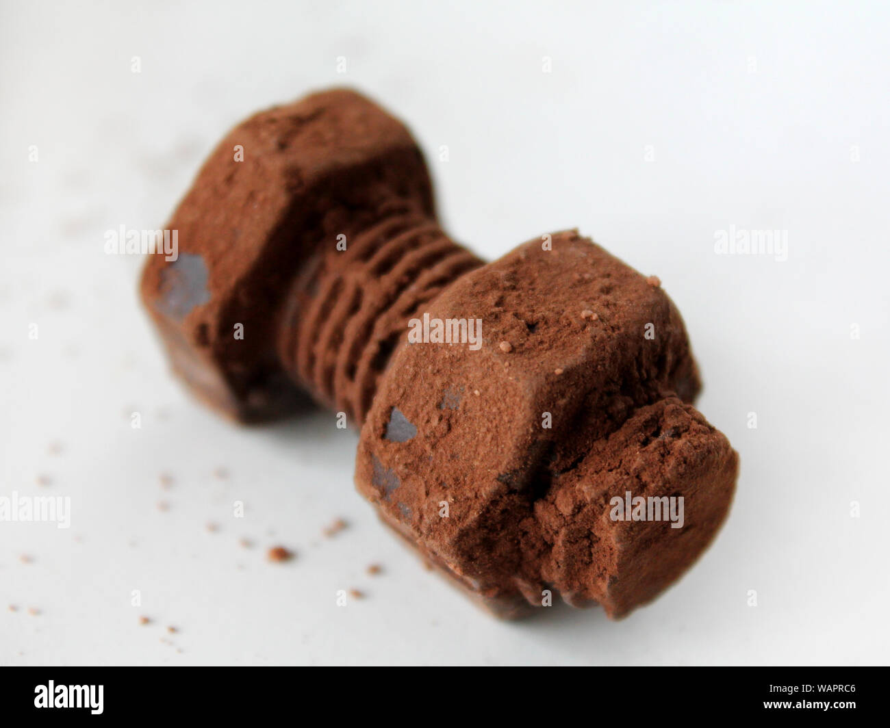 Rusty bolt and nut made of chocolate isolated on white background ...