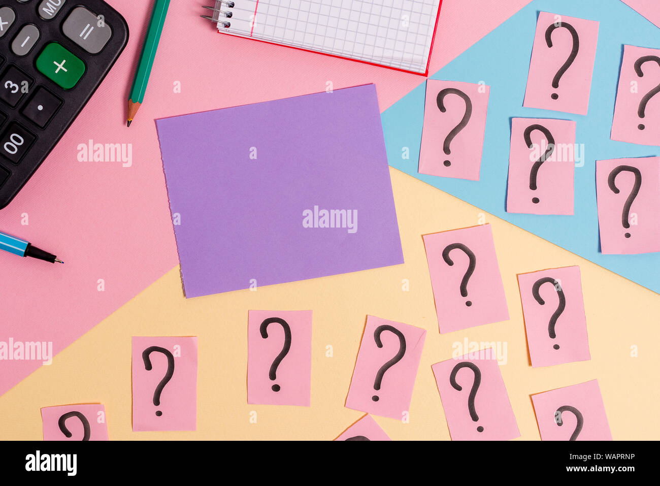 Mathematics stuff and writing equipment above pastel colours background ...