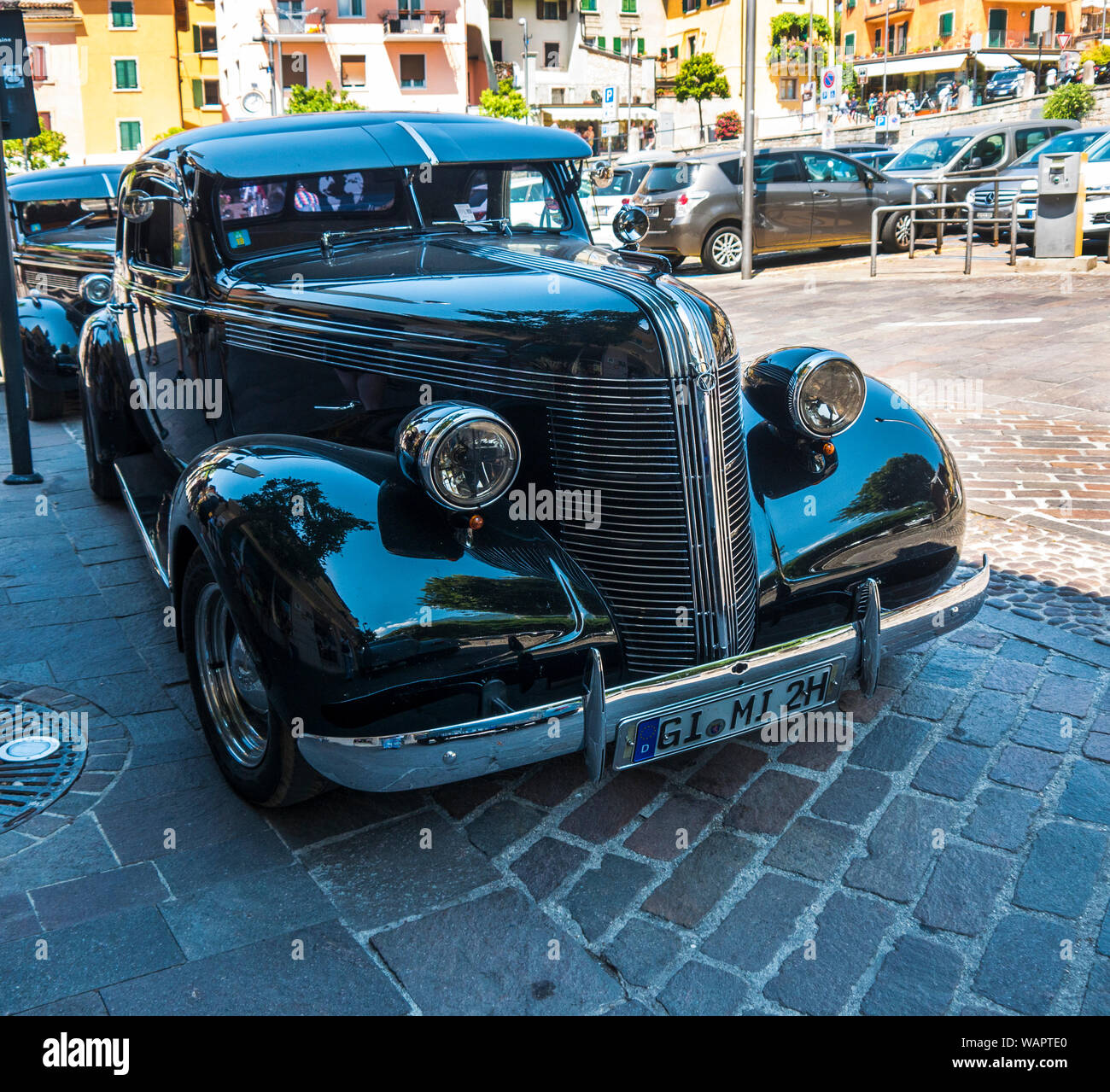Vintage cars with roaring engines appeared briefly in Malcesine on Lake ...