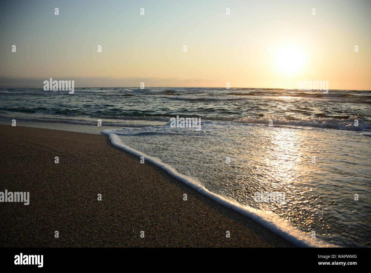 Breaking waves sand beach sea hi-res stock photography and images - Alamy
